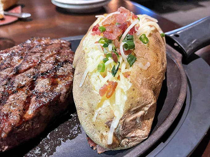 Not just a loaded baked potato—it's a spud that's living its best life, dressed for a night out with cheese, bacon, and green onion.