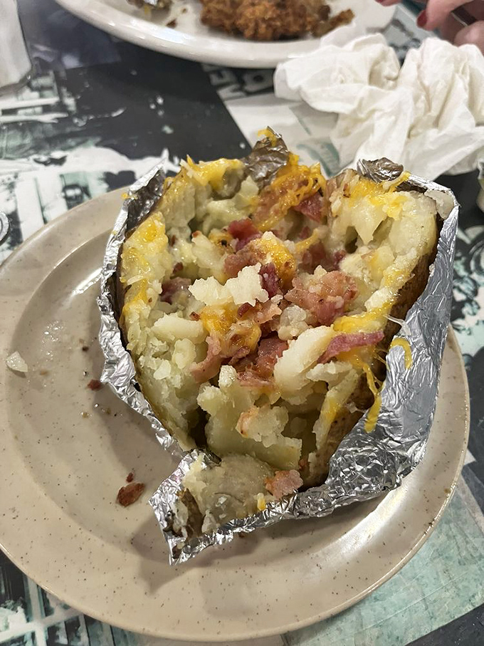 This loaded baked potato isn't just a side—it's a main event, stuffed with cheese and bacon that's melted into every nook and cranny.