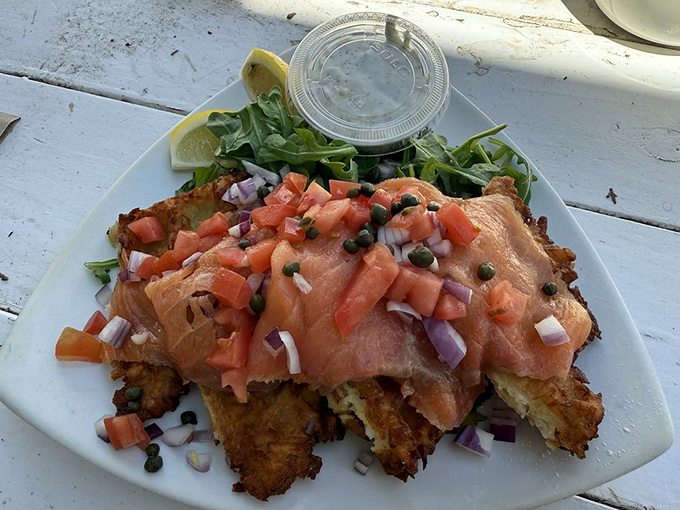 This savory waffle topped with lox and fresh vegetables proves that waffles, like the best character actors, can play both sweet and savory roles brilliantly.