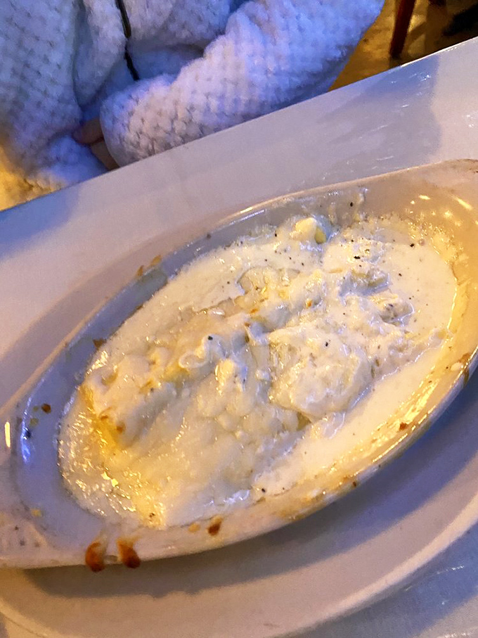 The creamy, dreamy perfection of what appears to be manicotti with alfredo sauce&mdash;basically a warm hug on a plate.