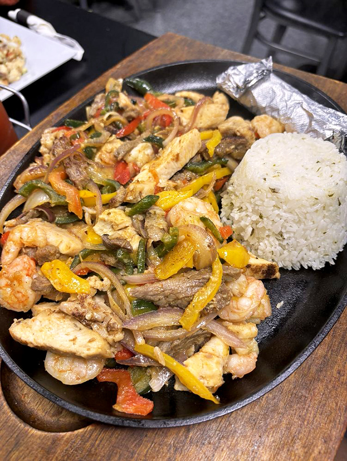 A sizzling fajita platter that's part dinner, part performance art. The colorful peppers and seafood medley create a fiesta for both eyes and palate.