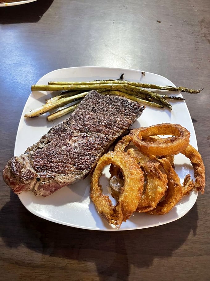 This NY strip with golden onion rings and asparagus spears is the holy trinity of steakhouse perfection.
