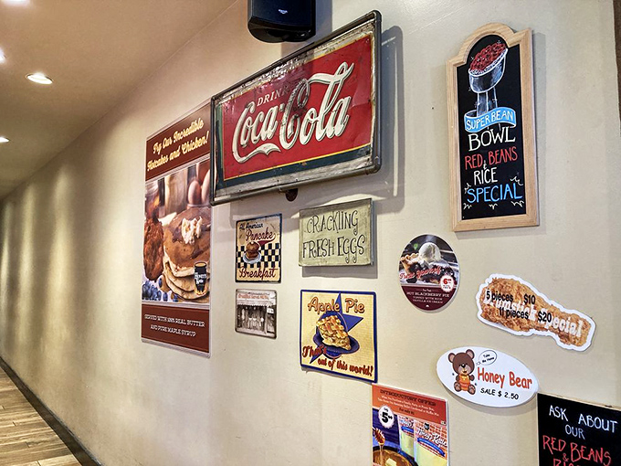 The wall of vintage signs tells you everything: this place respects tradition while your arteries respectfully disagree.