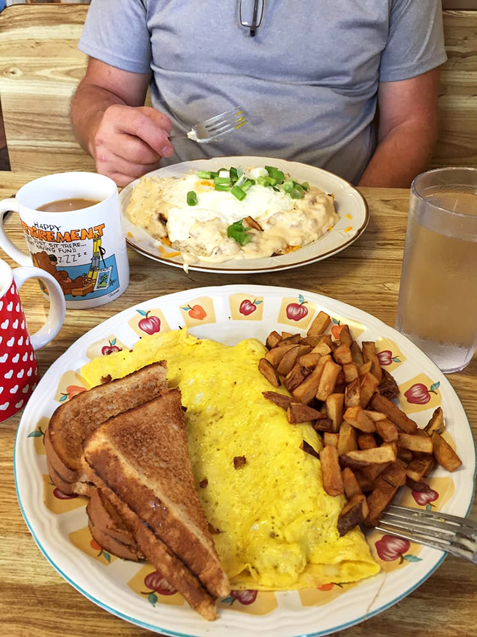 Breakfast architecture at its finest: a golden waffle foundation supporting a perfect scramble, with green onions adding both color and zip to this morning masterpiece.