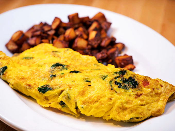 This isn't just any omelet&mdash;it's a perfectly executed golden envelope delivering vegetables and cheese with the tenderness they deserve.