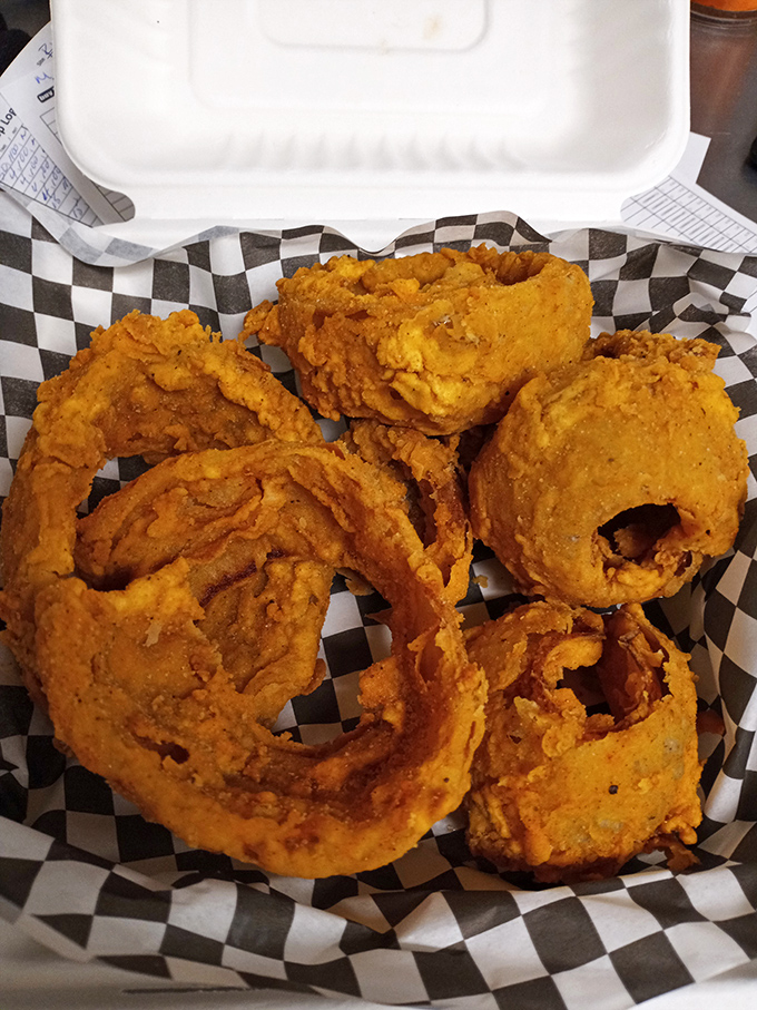 Onion rings that shatter with each bite, revealing sweet onion within. The perfect companion for when your mouth needs a brief vacation from the heat. 