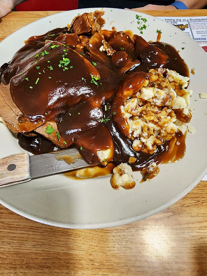 Roast beef swimming in rich brown gravy&mdash;a plate that doesn't just satisfy hunger but hugs your soul from the inside out.