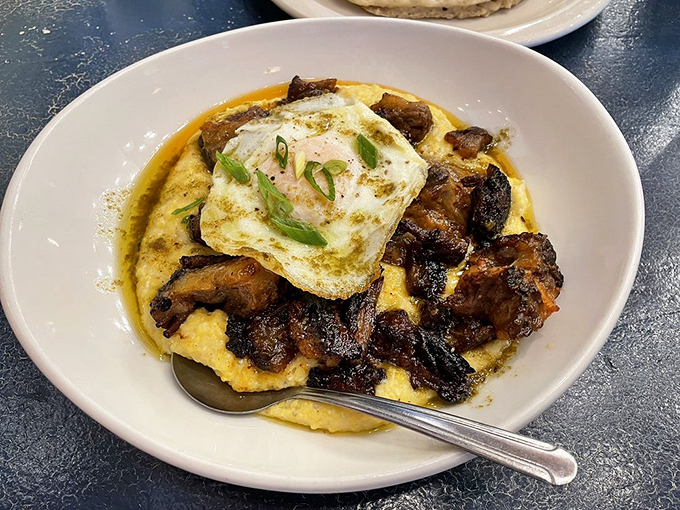 Grits transformed from humble to haute cuisine&mdash;crowned with a sunny egg and surrounded by meat that clearly took its sweet time getting this delicious.