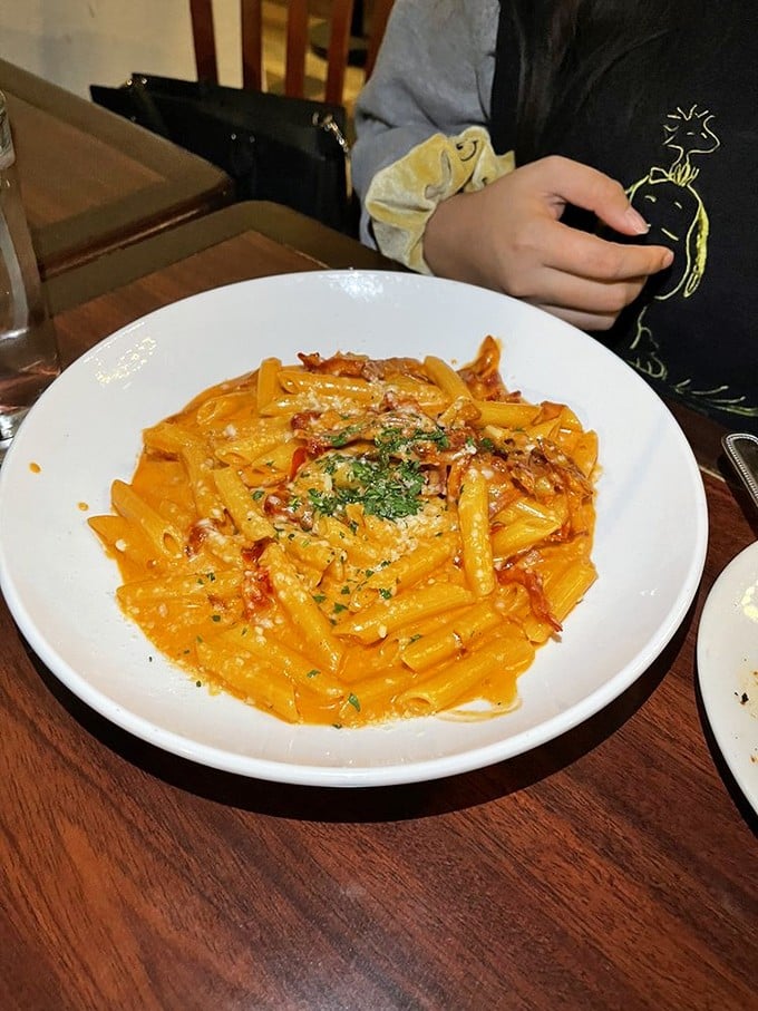 A coral-hued vodka sauce clinging lovingly to penne. The kind of dish that ruins other pink sauces for you forever.