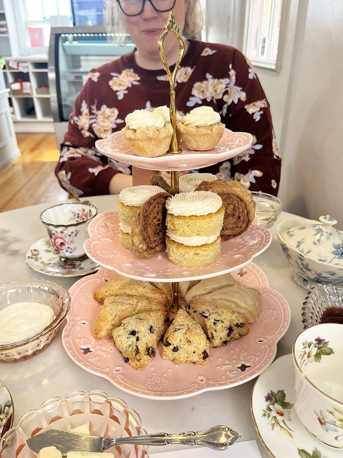 Afternoon tea elevated to an art form. That three-tiered stand of treats isn't just food—it's a portable celebration waiting to happen.