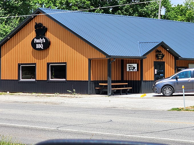 Pauly's BBQ's rustic wooden exterior promises the kind of authentic smokehouse flavors that no amount of fancy urban food styling can replicate.