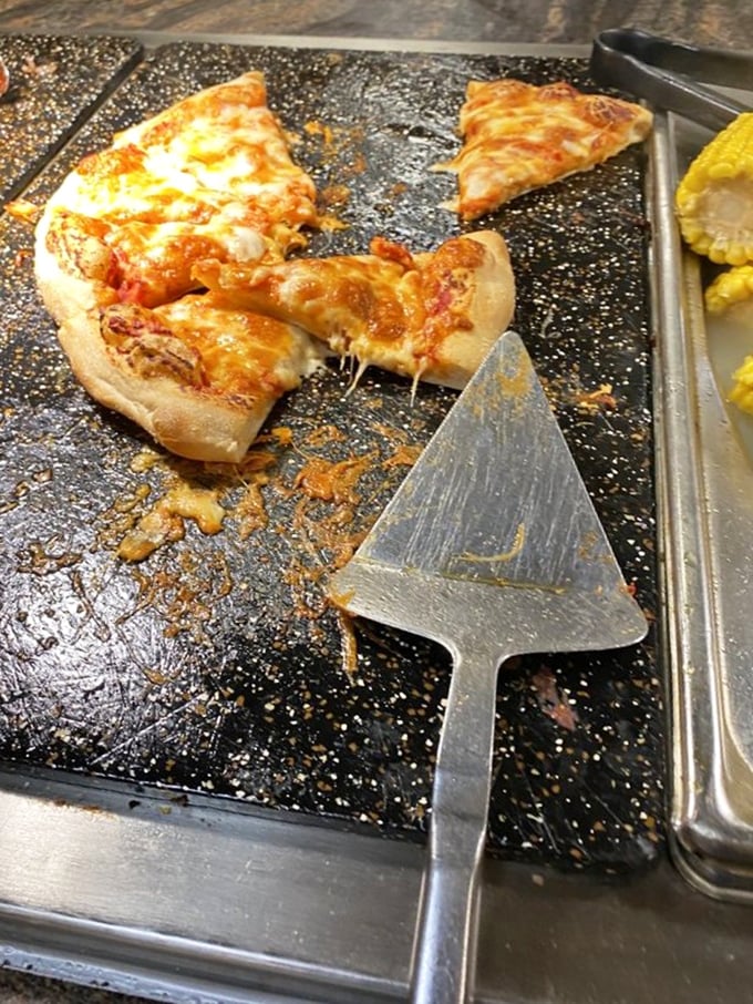 Pizza that hasn't been fossilized under heat lamps. The cheese pull is real, folks&mdash;a rare achievement in the all-you-can-eat universe.