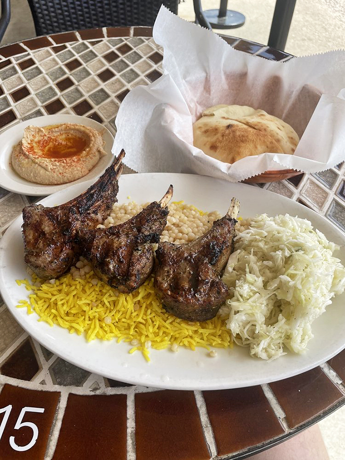 Lamb chops with the char marks of perfection. That beautiful caramelization is what happens when fire and protein have a passionate conversation.
