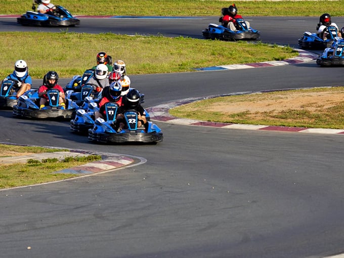 The true test of friendship: maintaining your smile while your buddy passes you on the inside of turn three.