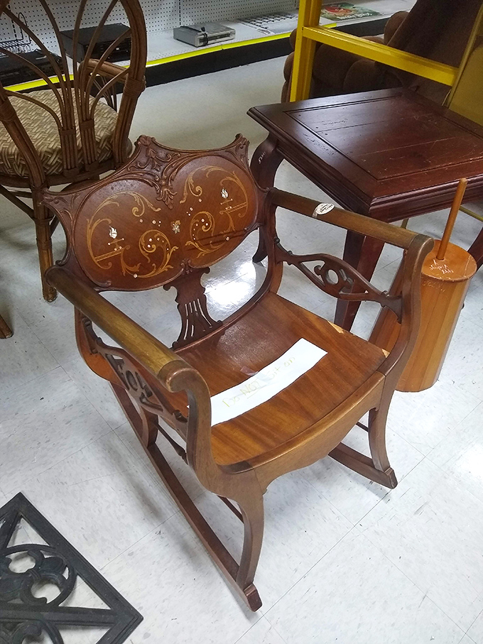 This ornately carved wooden chair isn't just furniture—it's functional art with armrests that have supported elbows through decades of contemplation.