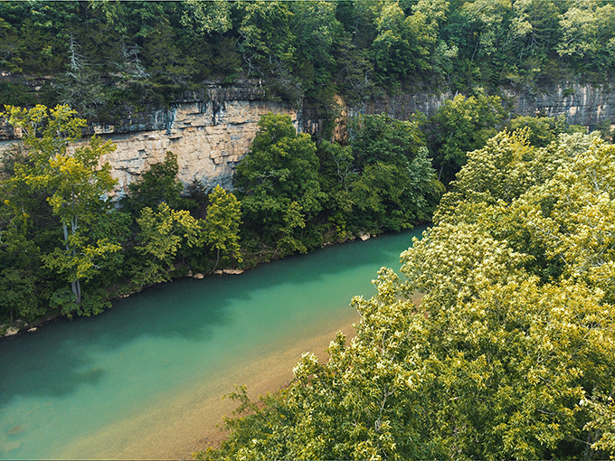 The Buffalo River cuts through limestone bluffs like nature's own sculpture garden, its emerald waters inviting adventurers year-round.