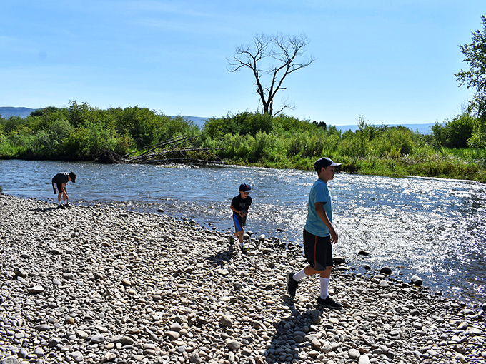 Riverside tranquility just minutes from your front door—where skipping stones and catching memories doesn't cost a dime.