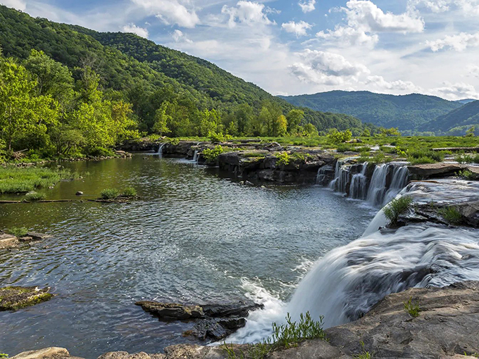 Water cascades over ancient stone ledges, creating nature's perfect soundtrack. These falls offer a meditative escape just minutes from downtown's brick-lined streets.
