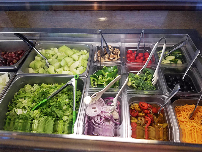 The salad bar &ndash; nature's colorful bounty arranged in stainless steel containers. The place where good intentions meet reality.