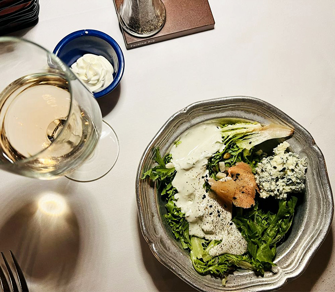 A salad that doesn't apologize for being healthy, dressed in what appears to be the kind of ranch dressing that makes vegetables worth eating.