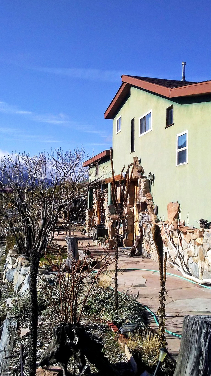 Desert architecture embraces the landscape with stone walls and earth tones. The kind of place that makes you reconsider your suburban existence.