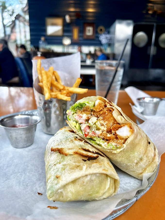 This wrap isn't just lunch &ndash; it's a portable feast of crispy shrimp, fresh greens, and creamy sauce in perfect harmony.