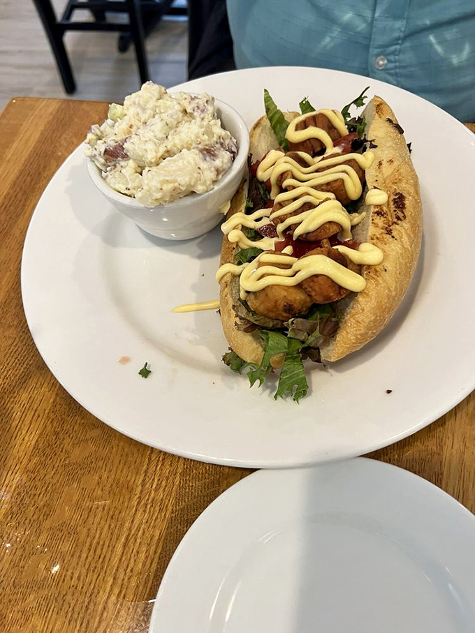 This sandwich-and-slaw combo proves that sometimes the simplest pleasures are the most satisfying. That aioli drizzle is pure chef's kiss.