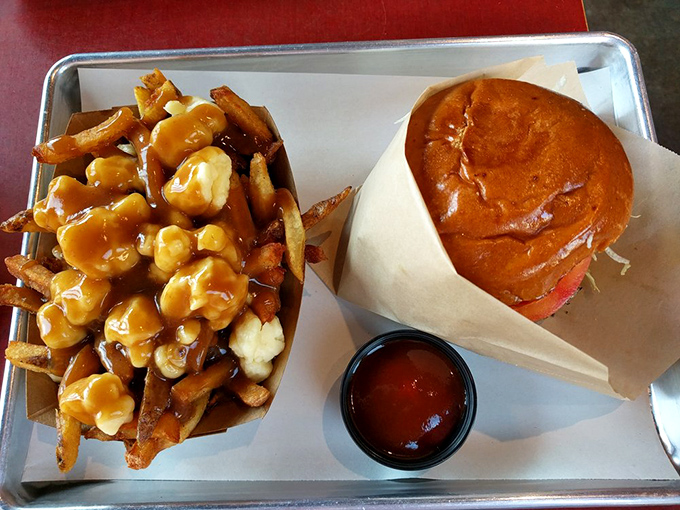 Poutine perfection meets burger brilliance. The cheese curds and gravy on those fries are performing a delicious duet worthy of a standing ovation.