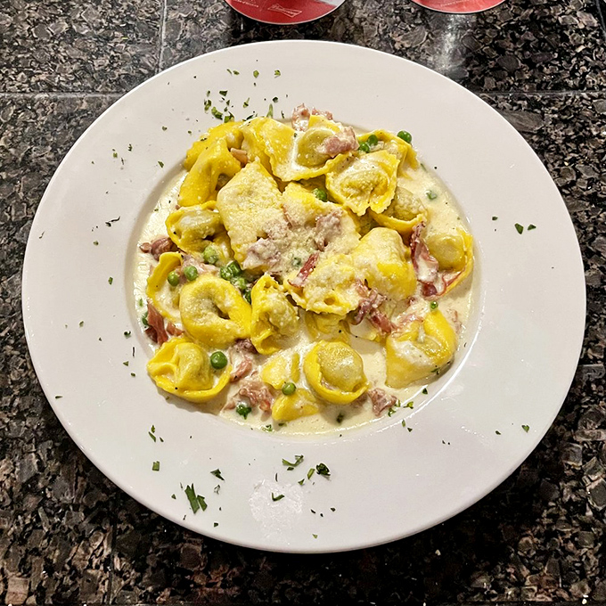 These sunshine-yellow tortellini aren't just pasta&mdash;they're little envelopes delivering joy directly to your taste buds.