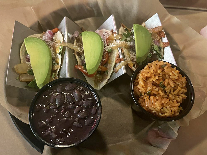 These tacos come with a side of black beans that look so good, you might forget you're supposed to be focusing on the main attraction.