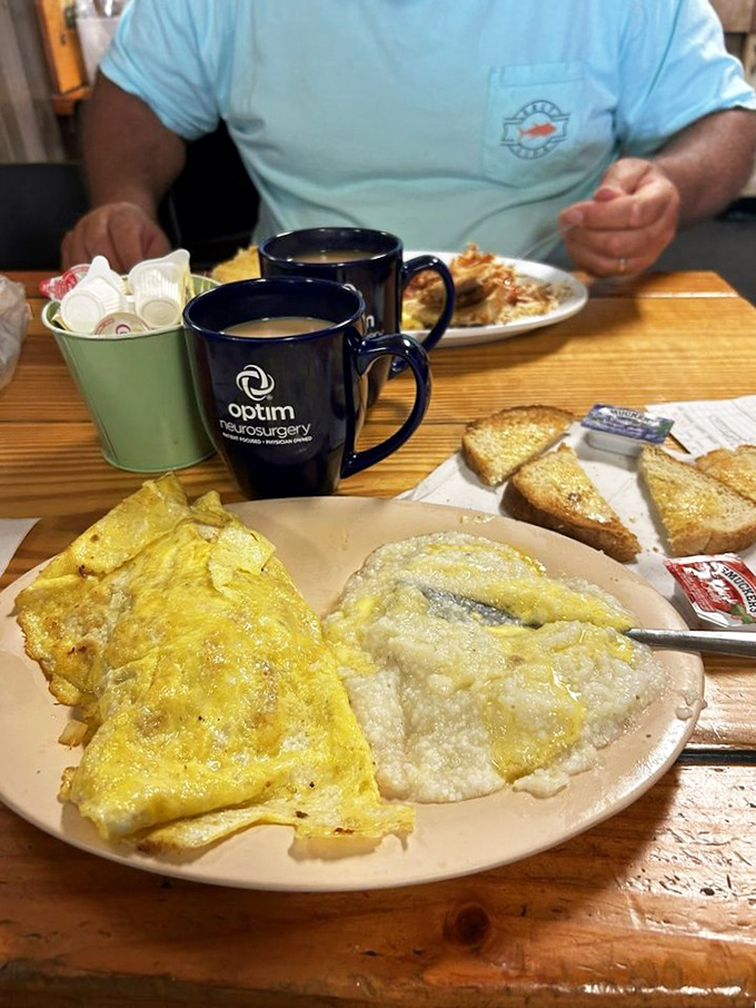 Breakfast heaven doesn't need fancy plates or garnishes, just perfectly executed Western omelets alongside golden toast and hash browns.