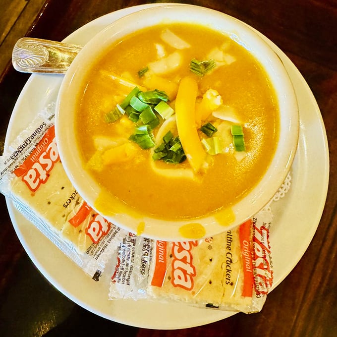 Wisconsin beer cheese soup that would make a Packers fan abandon the tailgate. Topped with cheese because, well, Wisconsin knows dairy isn't just a food group.
