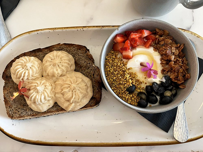 A breakfast that's both art gallery and science experiment&mdash;toast with piped peanut butter mousse alongside a yogurt bowl of carefully curated toppings.