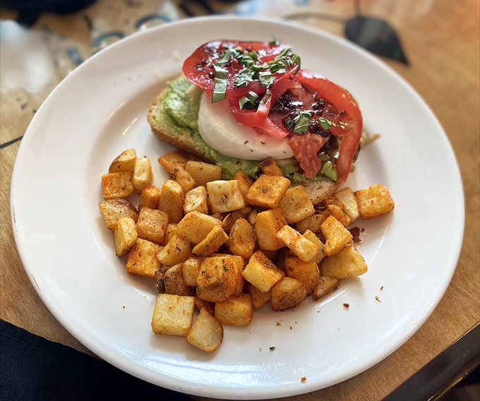 Avocado toast that doesn't require a second mortgage. Those perfectly seasoned potatoes are plotting to steal the show.