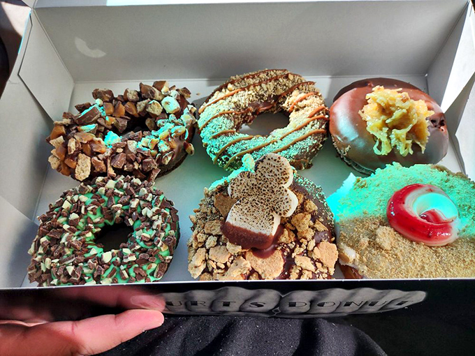 A box of possibilities. Like a paint palette of frosting and toppings, each donut offers its own sugary personality. The hardest question: which one first?