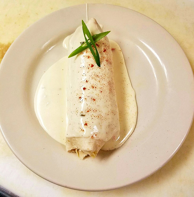 This isn't just a burrito; it's a masterclass in elegant wrapping. The creamy sauce creates a moat of deliciousness you'll want to swim in.