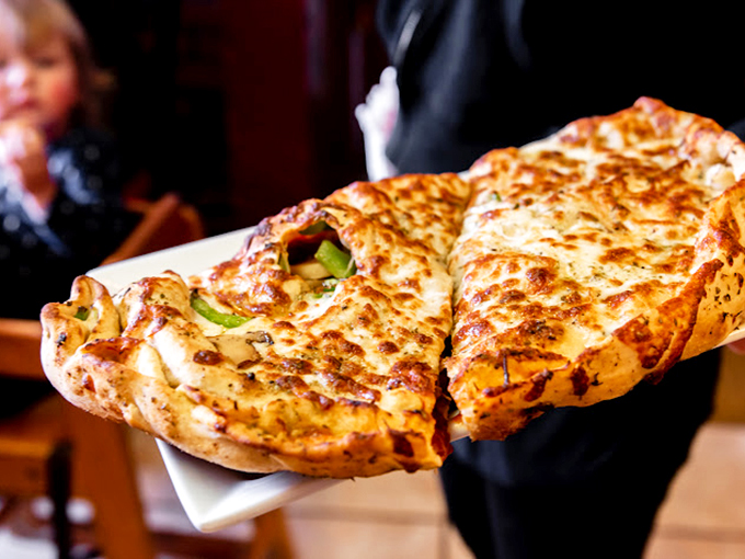 The calzone &ndash; pizza's mysterious, folded cousin that keeps its cheesy secrets hidden until that first, steam-releasing bite.