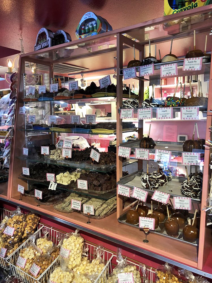 This glass shrine to confectionery artistry showcases chocolate-dipped apples and fudge slabs that would make a nutritionist weep with forbidden desire.
