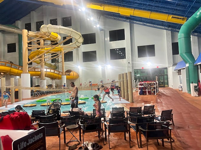 Water treehouse paradise where kids play splash-tag while adults secretly wish they could join in without sacrificing their dignity. 