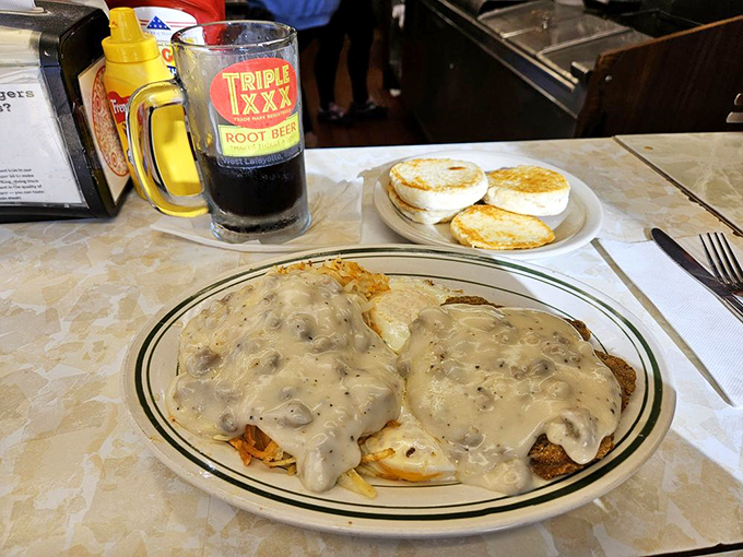 Chicken fried steak swimming in gravy so good you'll want to write it love letters. The English muffins on the side are ready for their supporting role.
