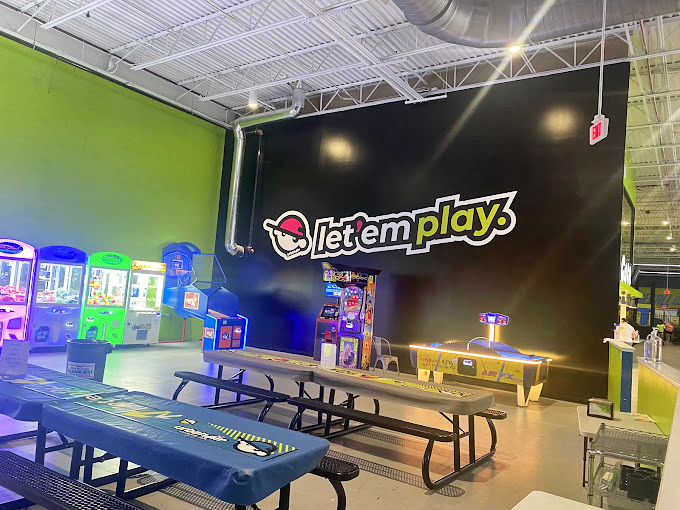 Neon lights and arcade sounds create that perfect nostalgic atmosphere where quarters disappear and high-score dreams are born.