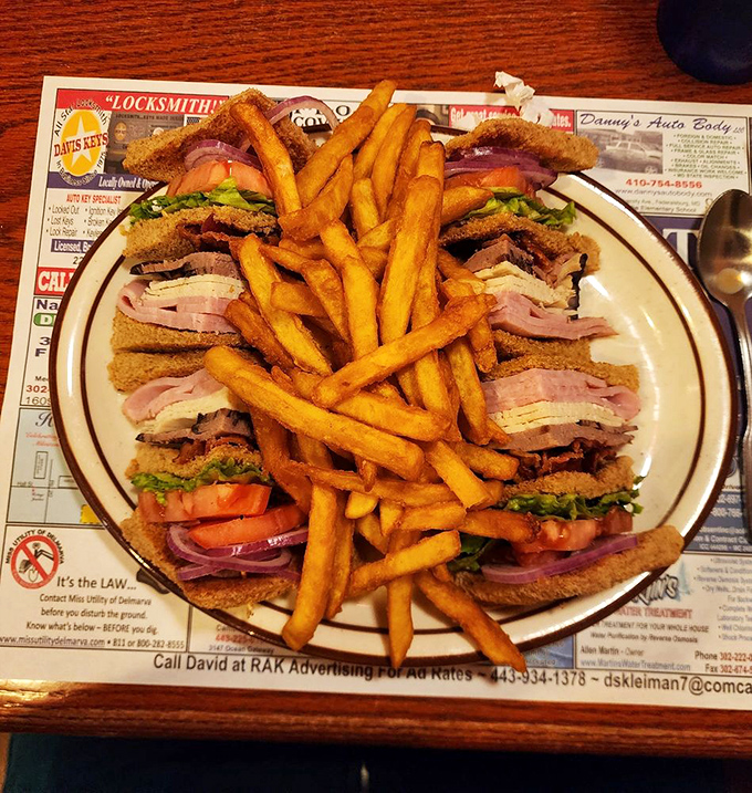 The club sandwich&mdash;architectural marvel of the diner world. Stacked higher than weekend pancakes and requiring a game plan before the first bite.