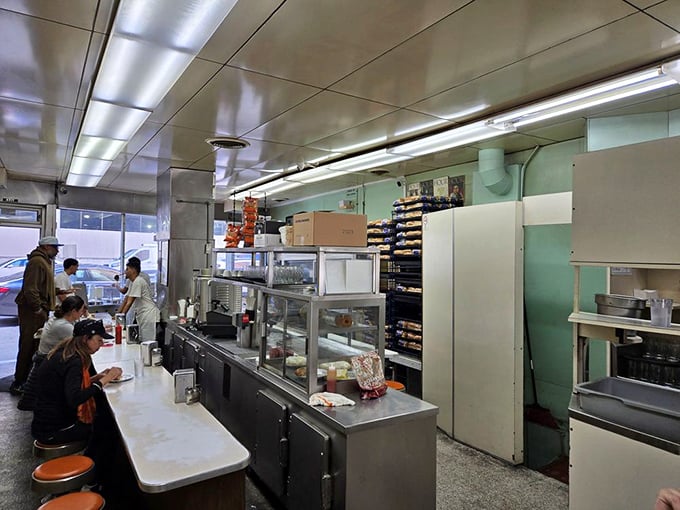 Behind the counter where miracles happen daily. This isn't just a diner &ndash; it's a stage where culinary theater has played for generations.
