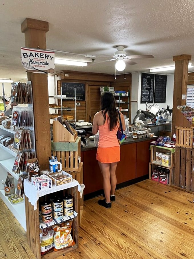 The bakery counter: where dreams and diets go to negotiate terms. That wooden floor has witnessed countless moments of pure joy.