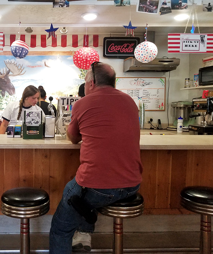 The universal posture of anticipation: Man at counter, minutes away from huckleberry enlightenment. We've all been there, friend.