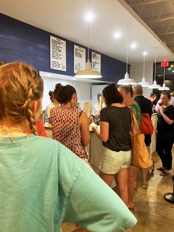 The universal language of anticipation. These customers aren't just in line—they're on a pilgrimage to flavor town.