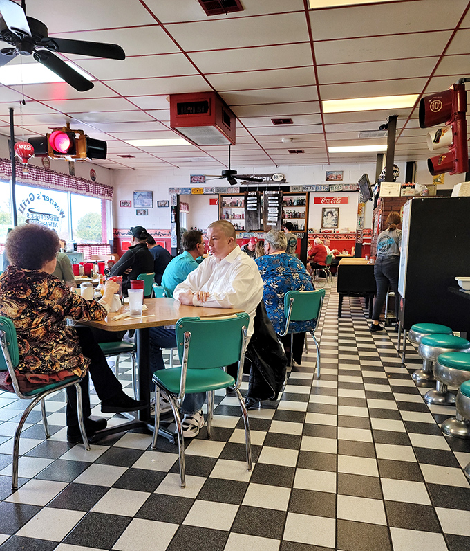 Regulars don't just eat here—they belong here. The checkered floor has witnessed thousands of conversations, confessions, and coffee refills.