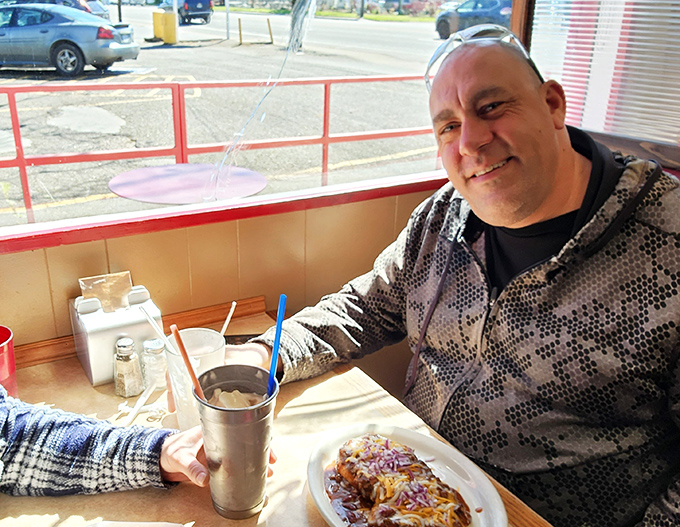 Red vinyl booths and wood-paneled walls create the perfect backdrop for the main attraction&mdash;food that makes conversation pause mid-sentence. 
