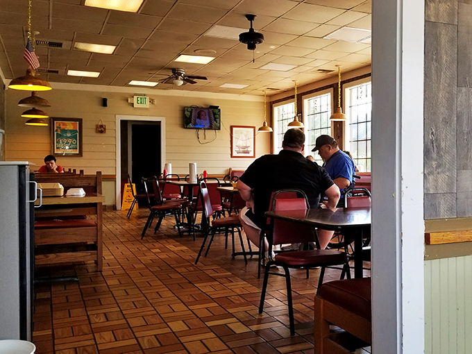 The universal language of good food being spoken here—heads bent over plates, conversations paused mid-bite, the silent symphony of satisfied diners.