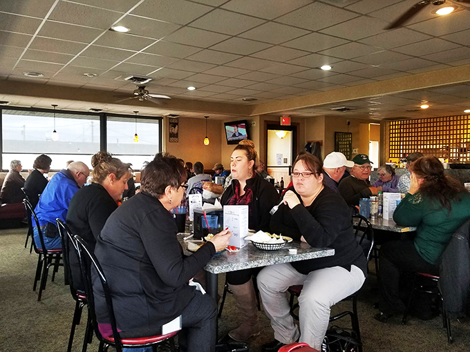 Where strangers become friends over shared appreciation of perfectly fried poultry—the true community center of Hays, Kansas.